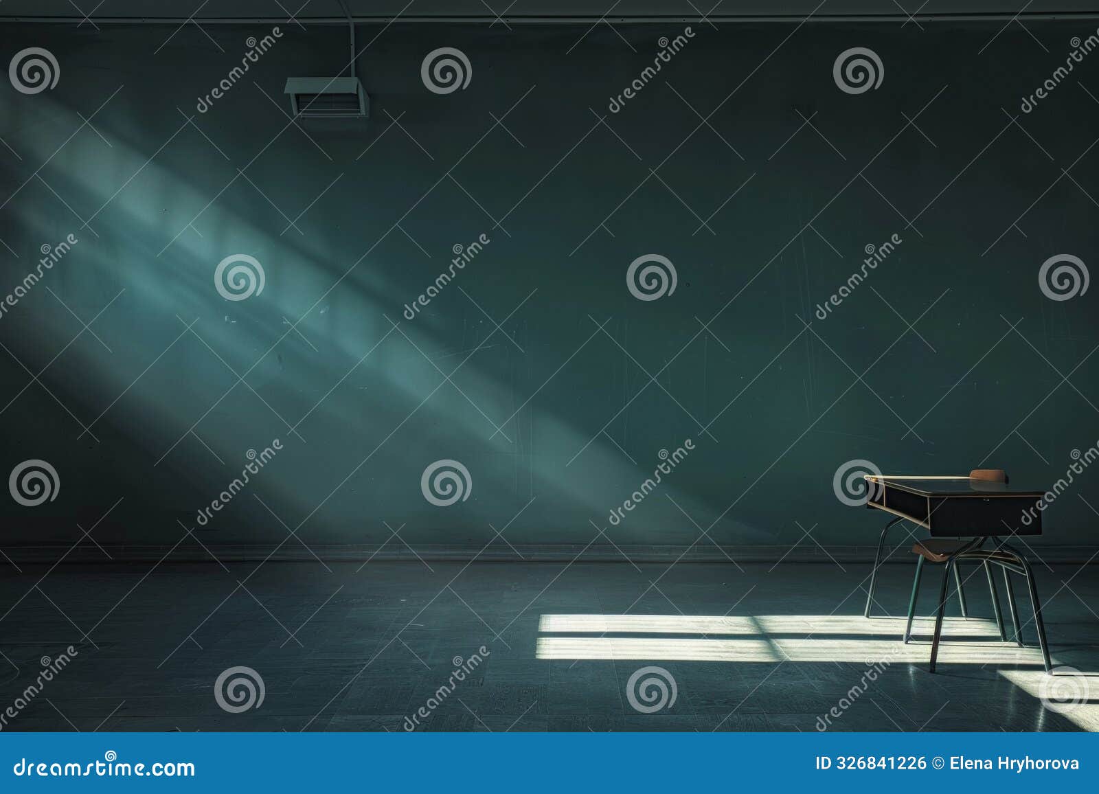 Dark Room with an Empty Desk and Chair Under a Light, Highlighting ...
