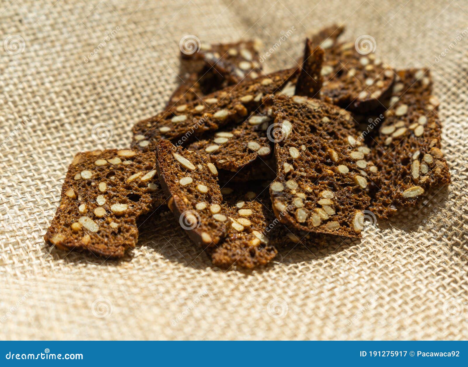 Dark Rye Crackers with Seeds on Sacking. Rustic Style Stock Image ...