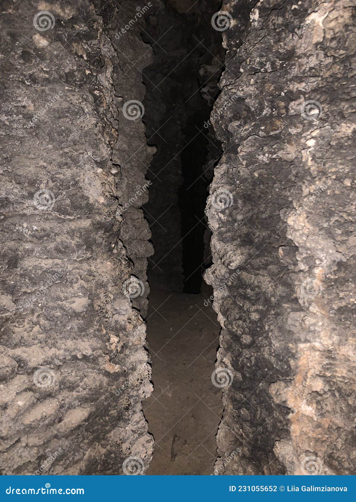 Dark and scary cave stock photo. Image of underground - 231055652