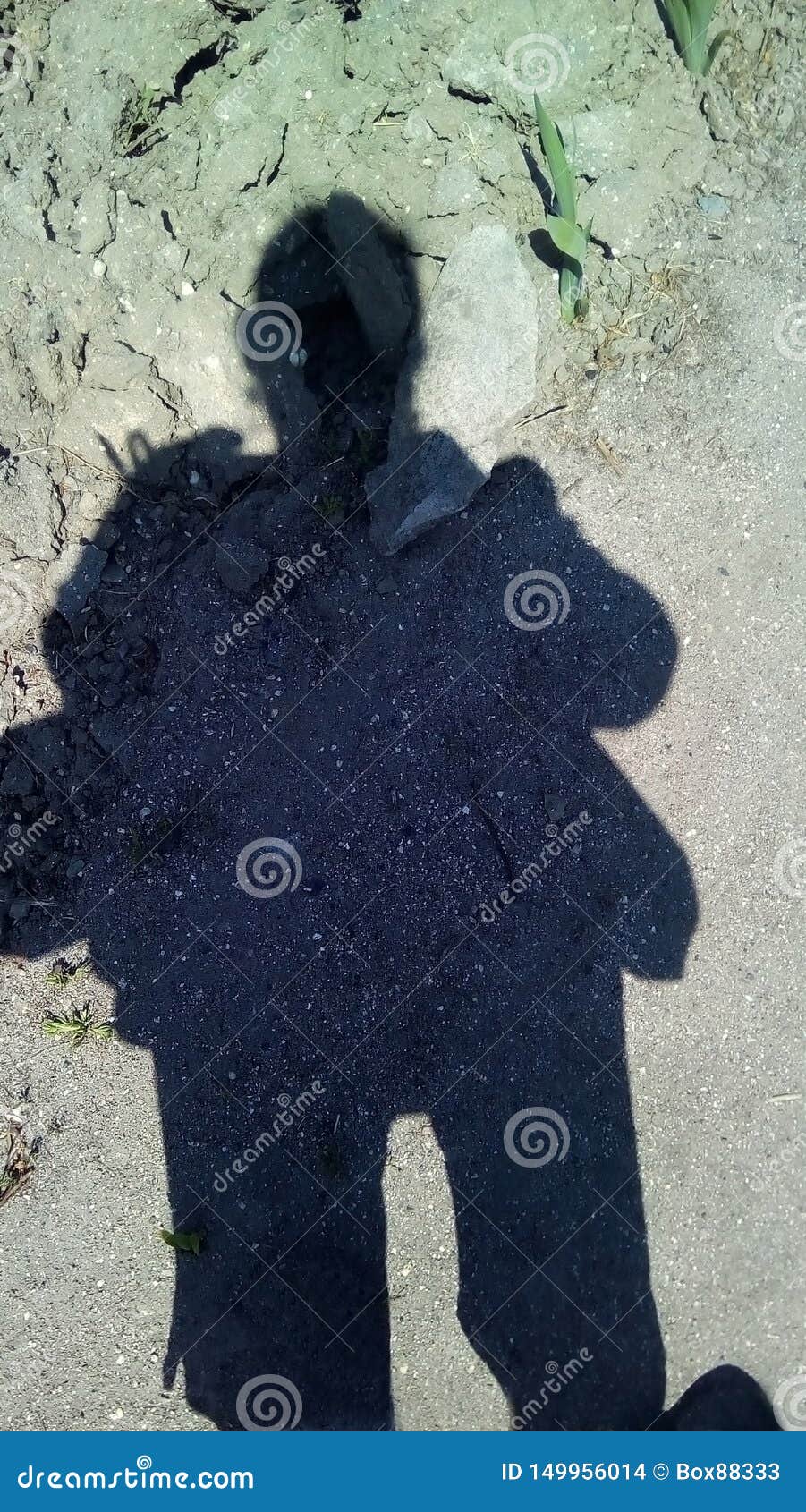 Dark Shadow of a Man Standing on a Gray Ground. Stock Photo - Image of ...