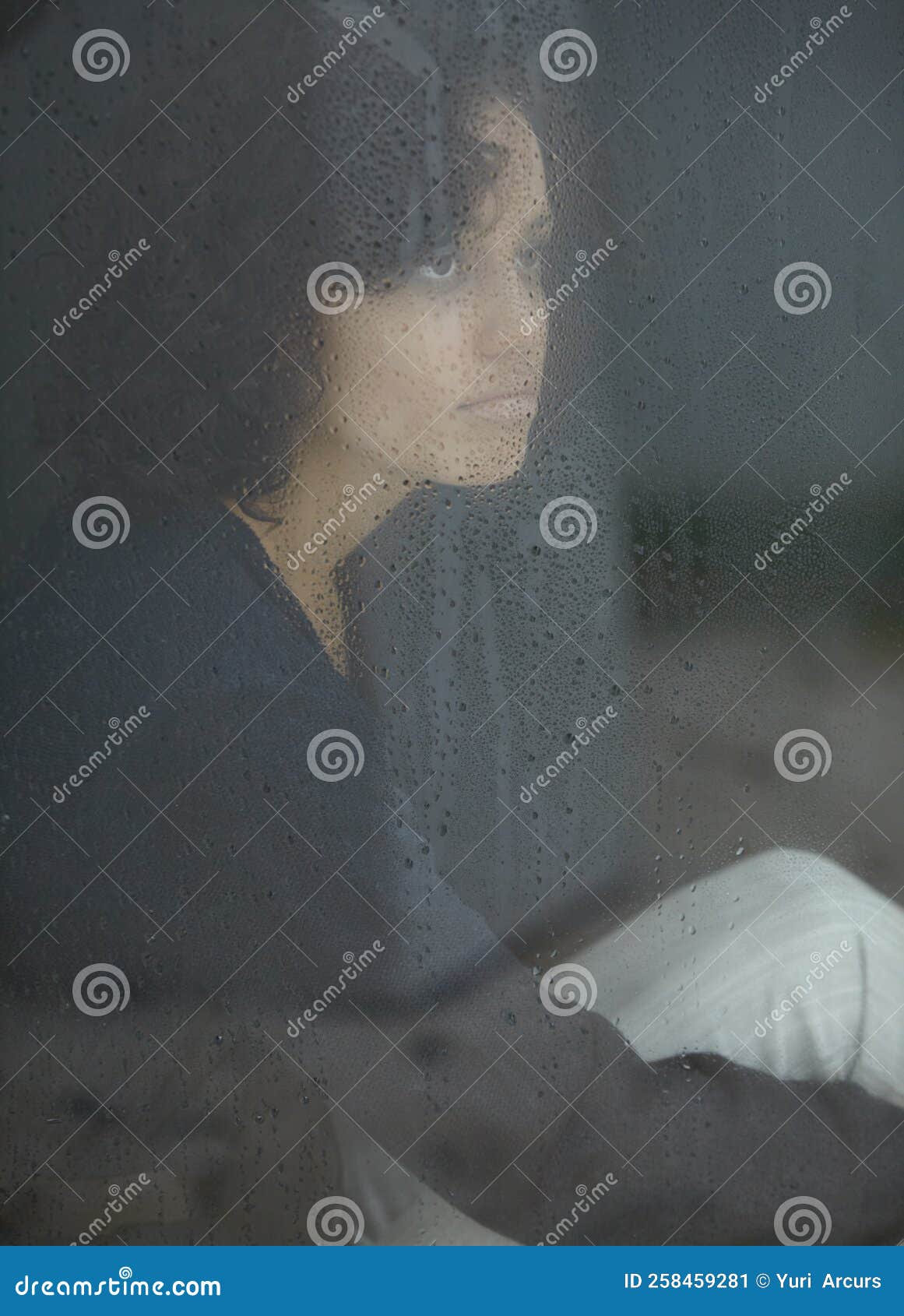 The Dark Side of Depression. a Sad Young Woman Looking Out at the Rain ...