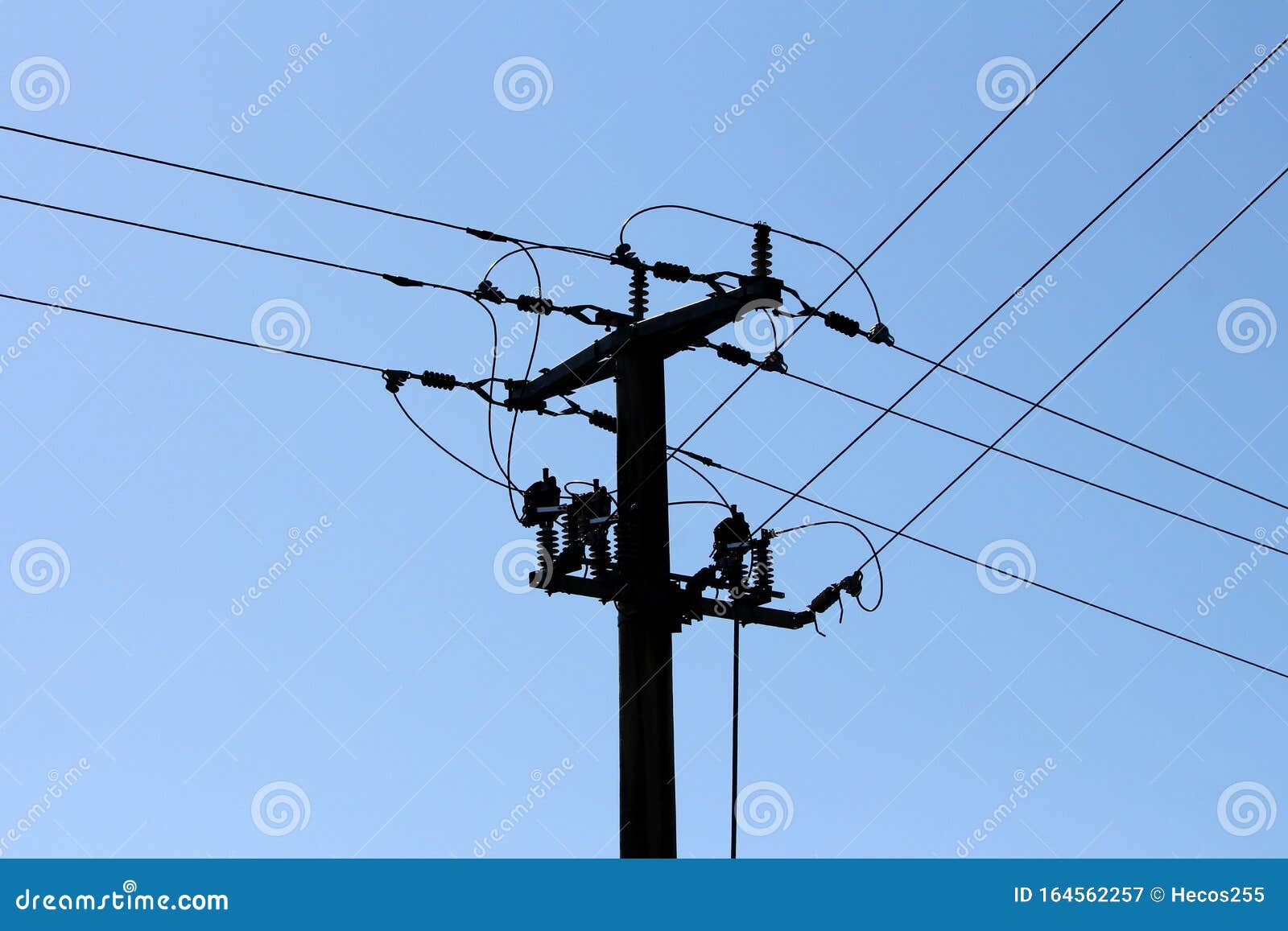 Dark Silhouette of Concrete Electrical Utility Pole with Multiple ...