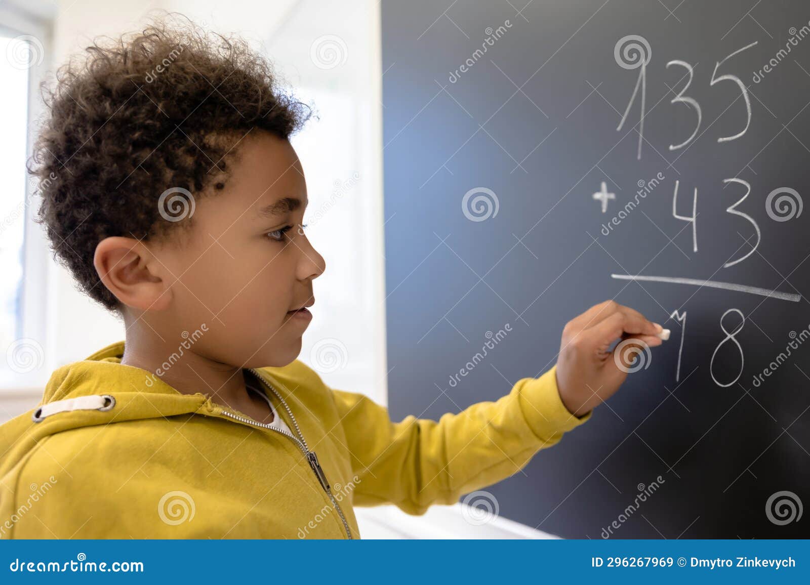 The Dark-skinned Boy Writing Fraction on the Board at Maths Lesson ...