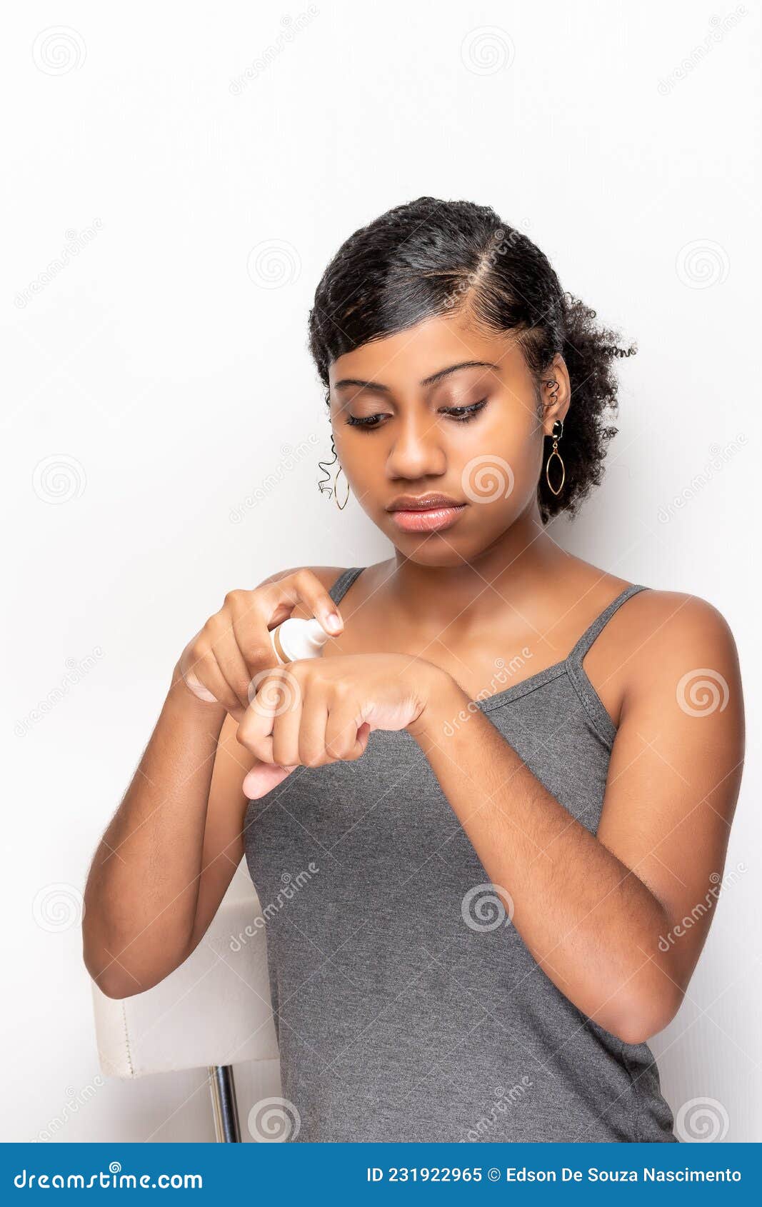 Dark Skinned Girl With Afro Hair Puts Dermatological Cream On Her Hand