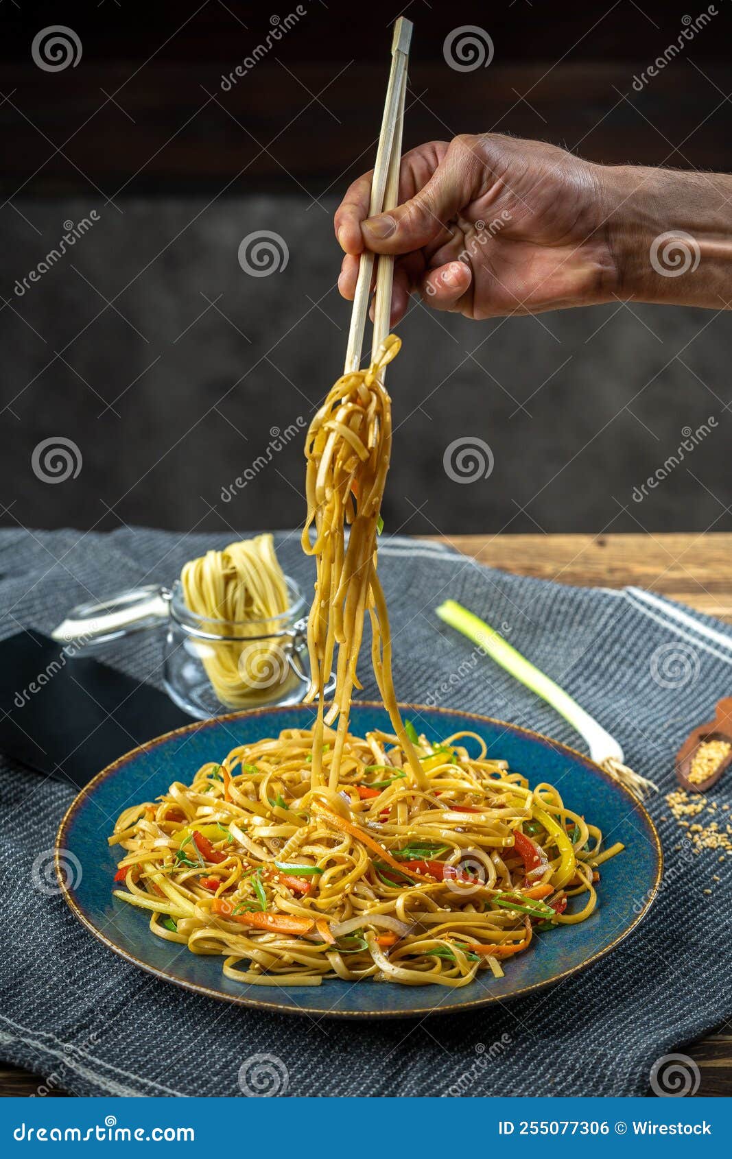 Dark Skinned Human Hand Taking Spaghetti with Chopsticks from Dinner ...
