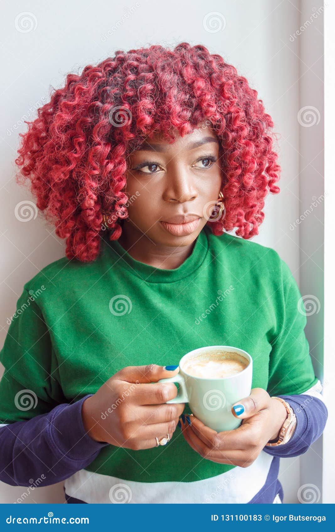 Dark Skinned Woman Dressed In Casual Clothes Holding Cup Of Hot Drink