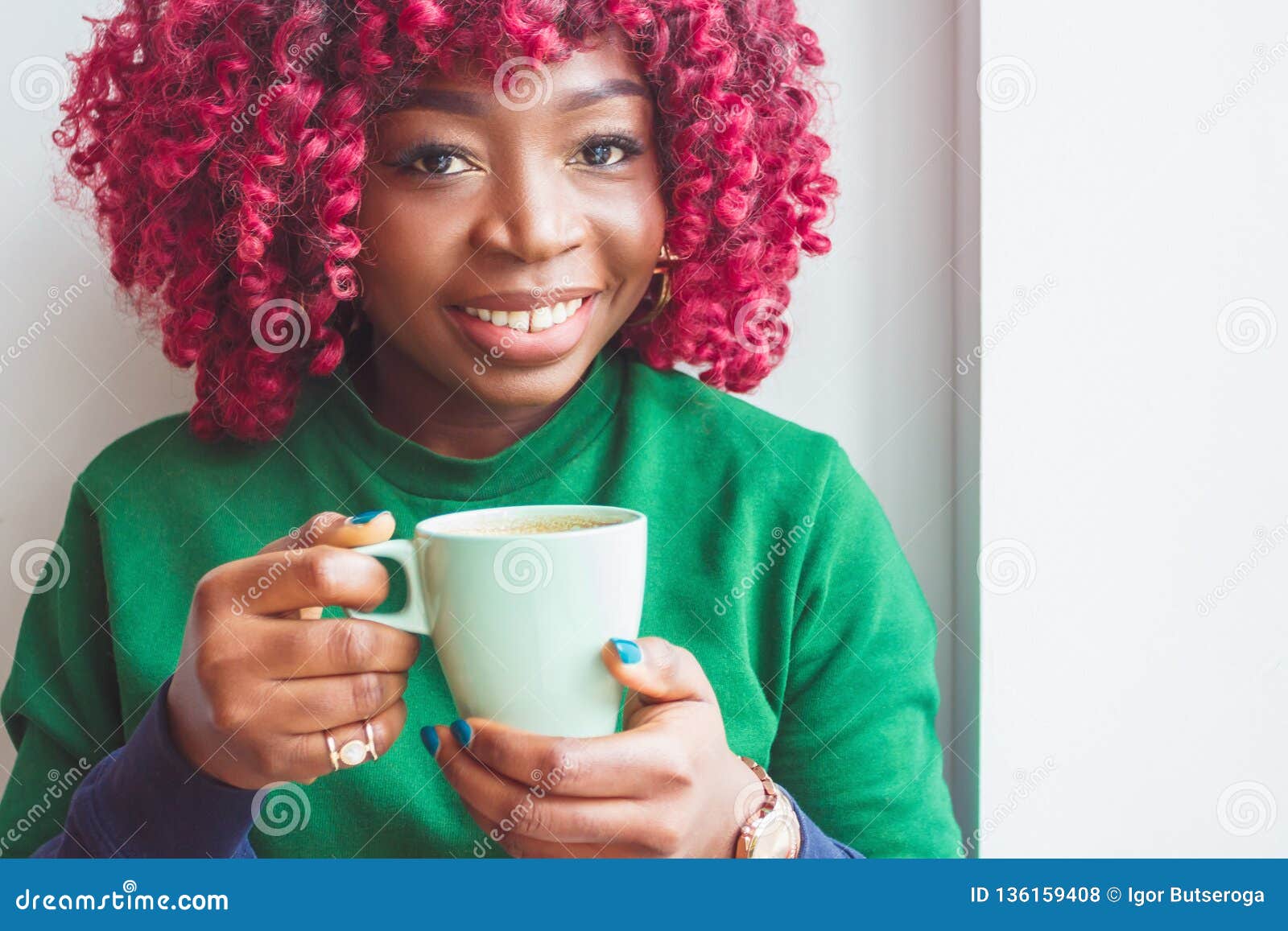 Dark Skinned Woman Dressed In Casual Clothes Holding Cup Of Hot Drink