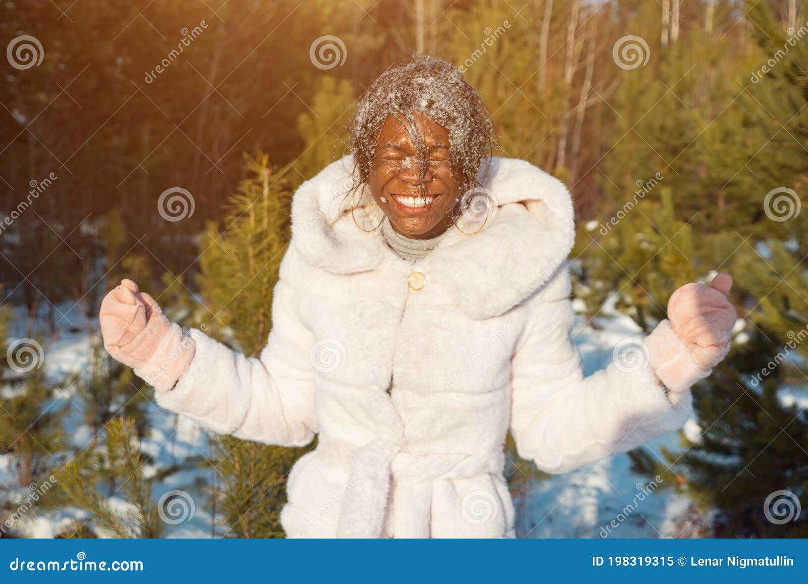 Dark-skinned Woman Laughing Playing with Snow Sunlight Stock Image ...