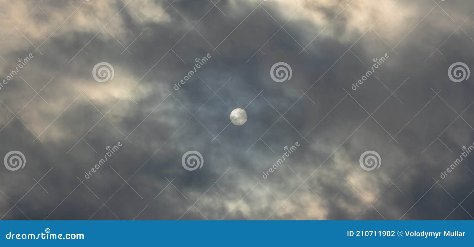 The Dark Sky is Covered with Continuous Clouds, through Which the Dim ...