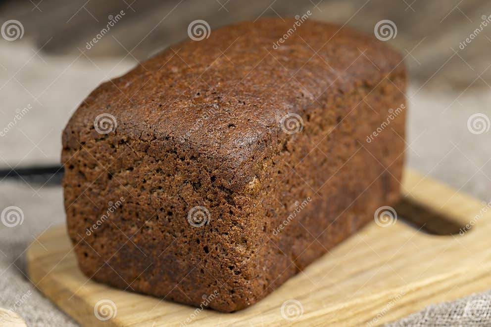 Dark Square Loaf of Bread on the Table Stock Photo - Image of natural ...