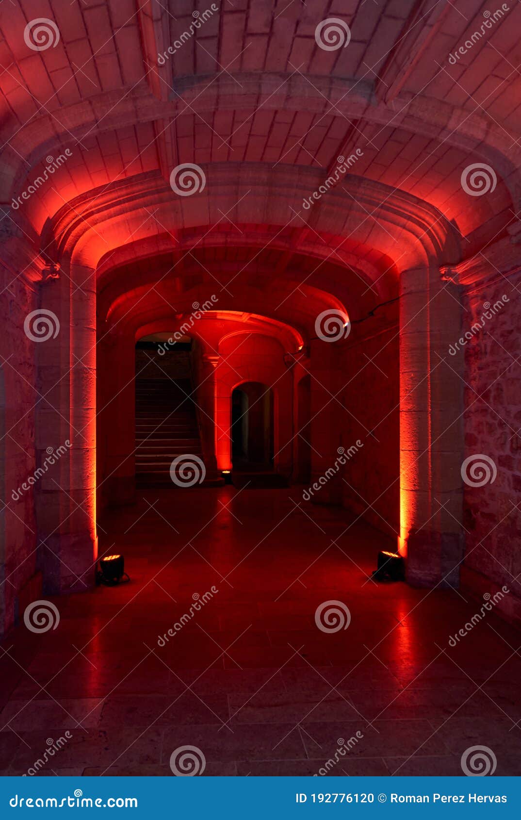 Dark Stone Interior Hallway Illuminated with Red Lights and at the End ...