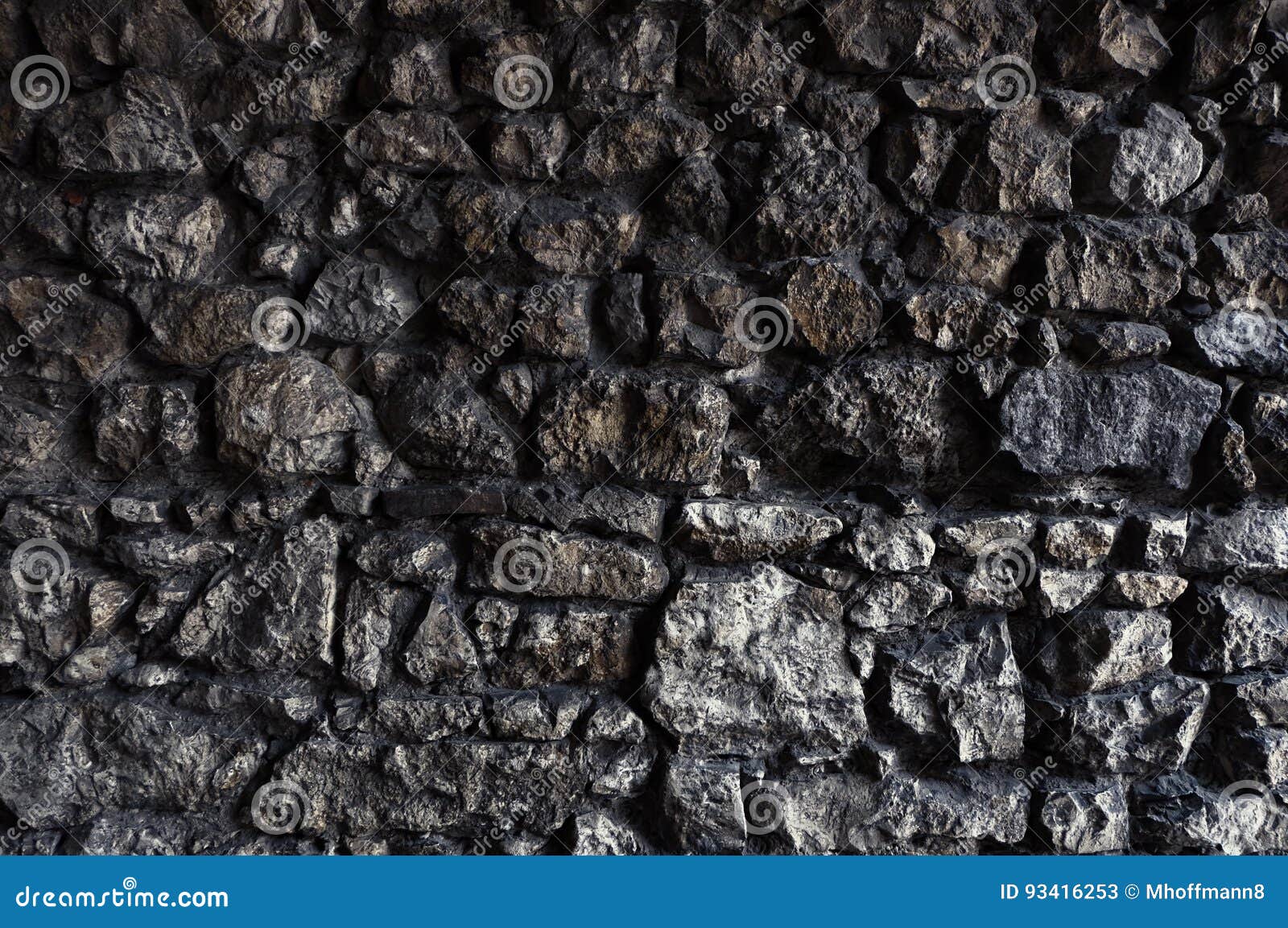 Dark Stone Wall Made Of Irregular And Rough Rocks Royalty-Free Stock ...