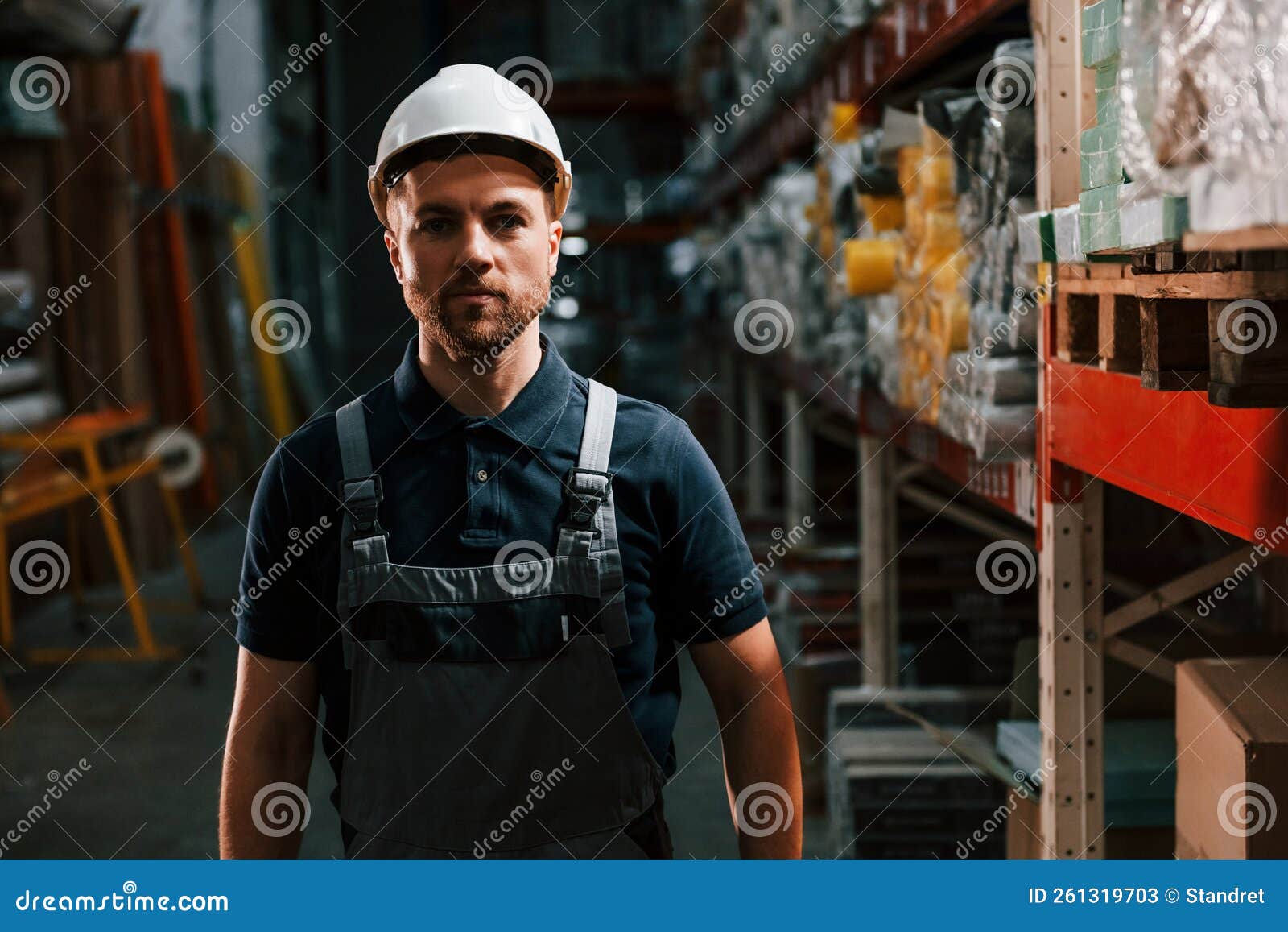 In Dark Store. Employee in Uniform is Working in the Storage Stock ...