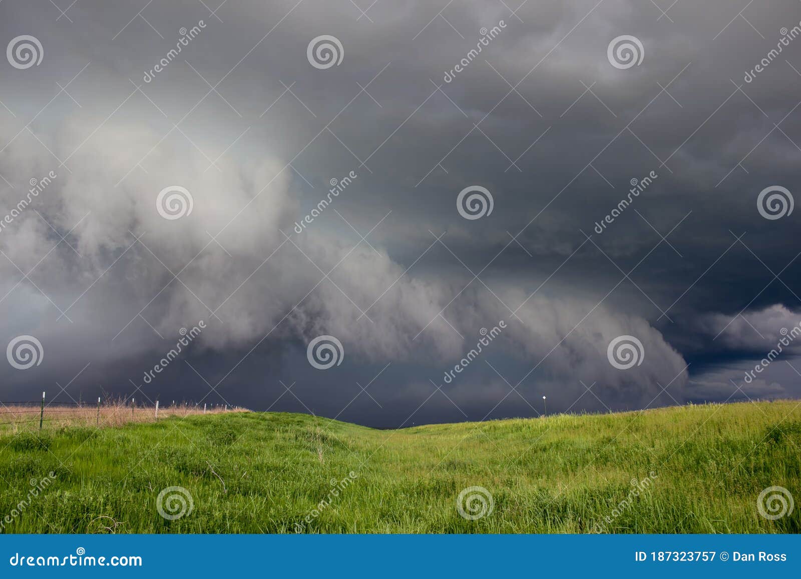 A Dark Storm Advances, Featuring a Ragged Shelf Cloud with Rain and ...