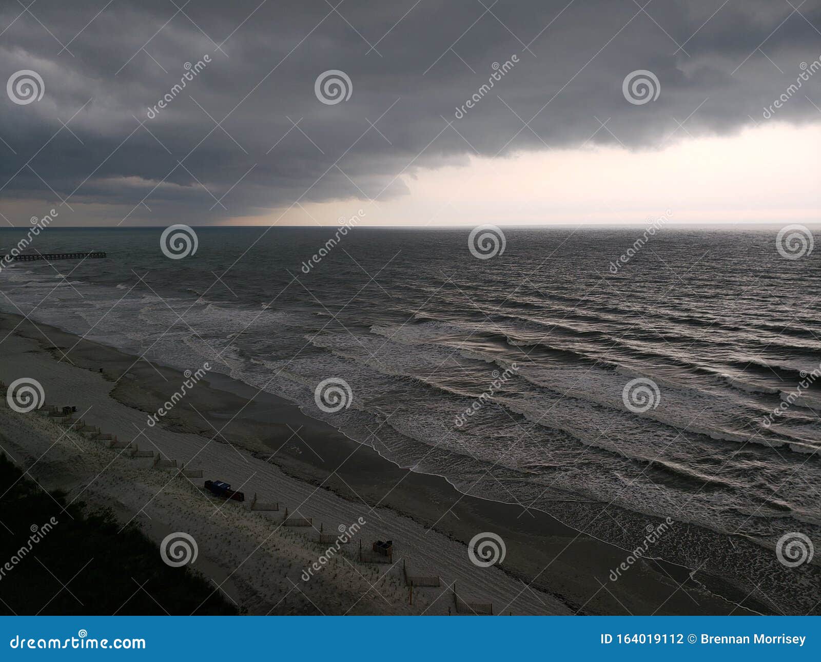 Dark and stormy beach stock photo. Image of storm, stormy - 164019112