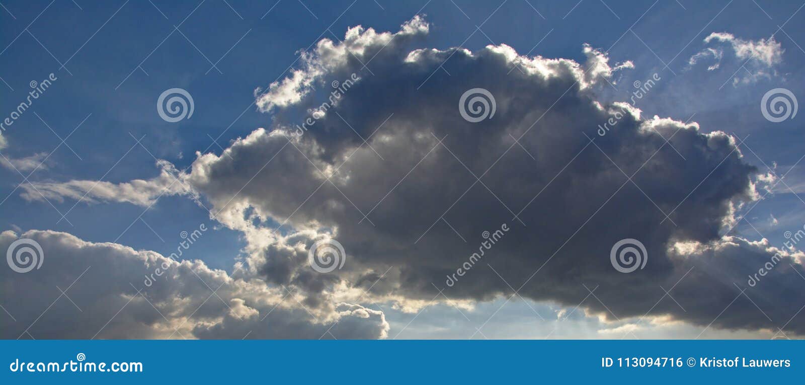 Dark Cumulus Cloud with Rimlight from the Sun Stock Photo - Image of ...