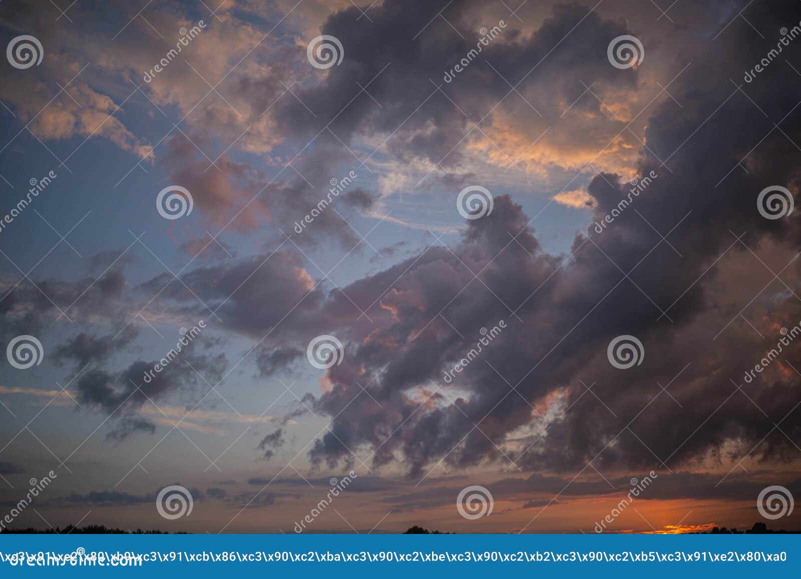 A Dark Thundercloud on the Background of Sunset Stock Photo - Image of ...