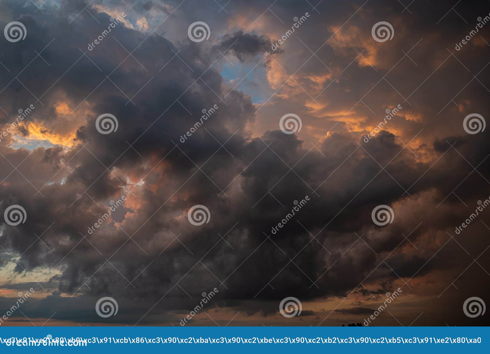 A Dark Thundercloud on the Background of Sunset Stock Photo - Image of ...