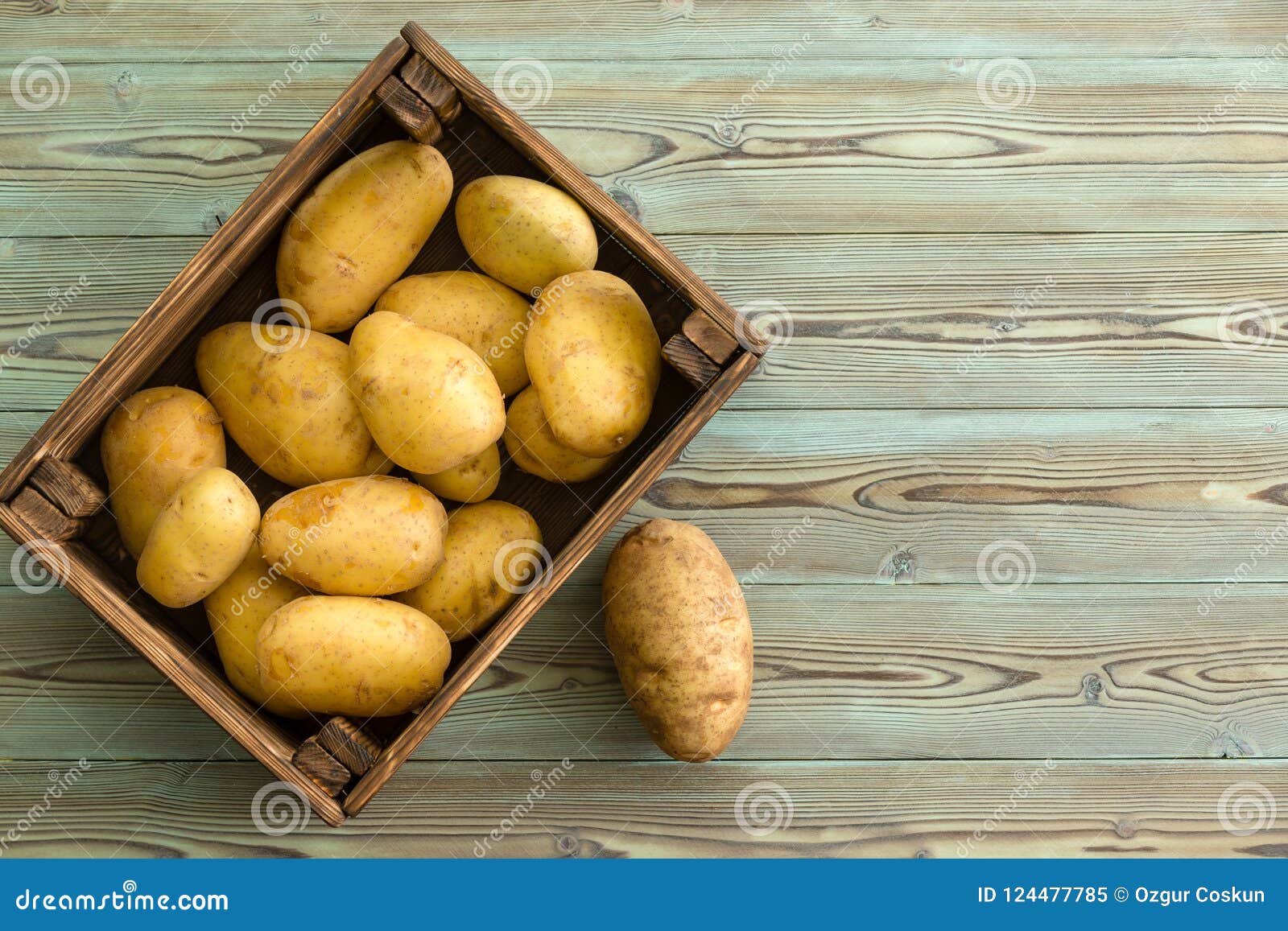 Dark Wood Container of Potatoes Sitting on Table Stock Image - Image of ...