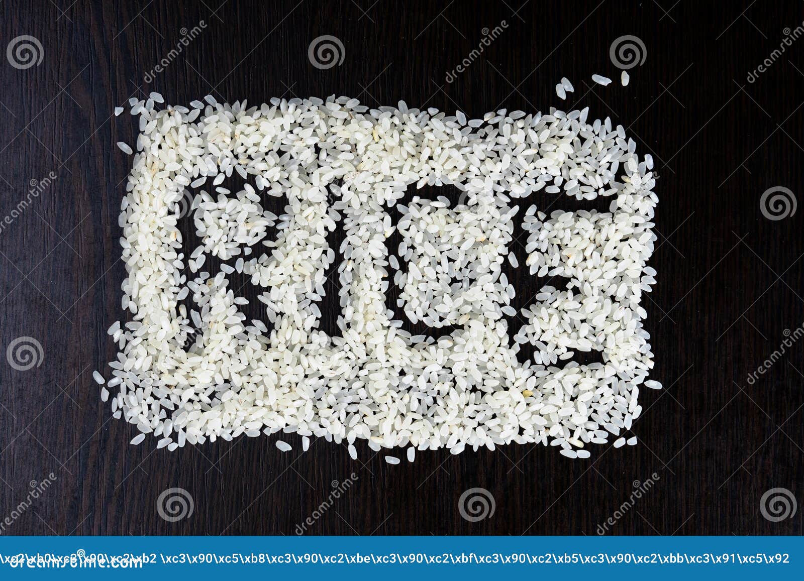 On A Dark Wood Table Lies White Rice In The Form Of A Rectangle Stock ...