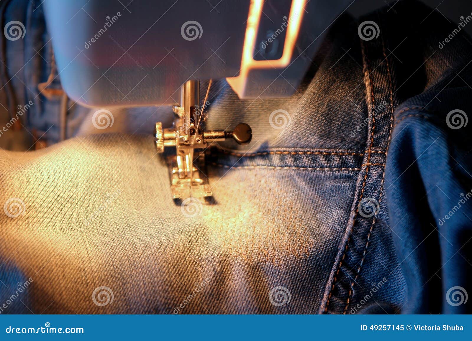 Darn jeans on the machine stock image. Image of tailor - 49257145