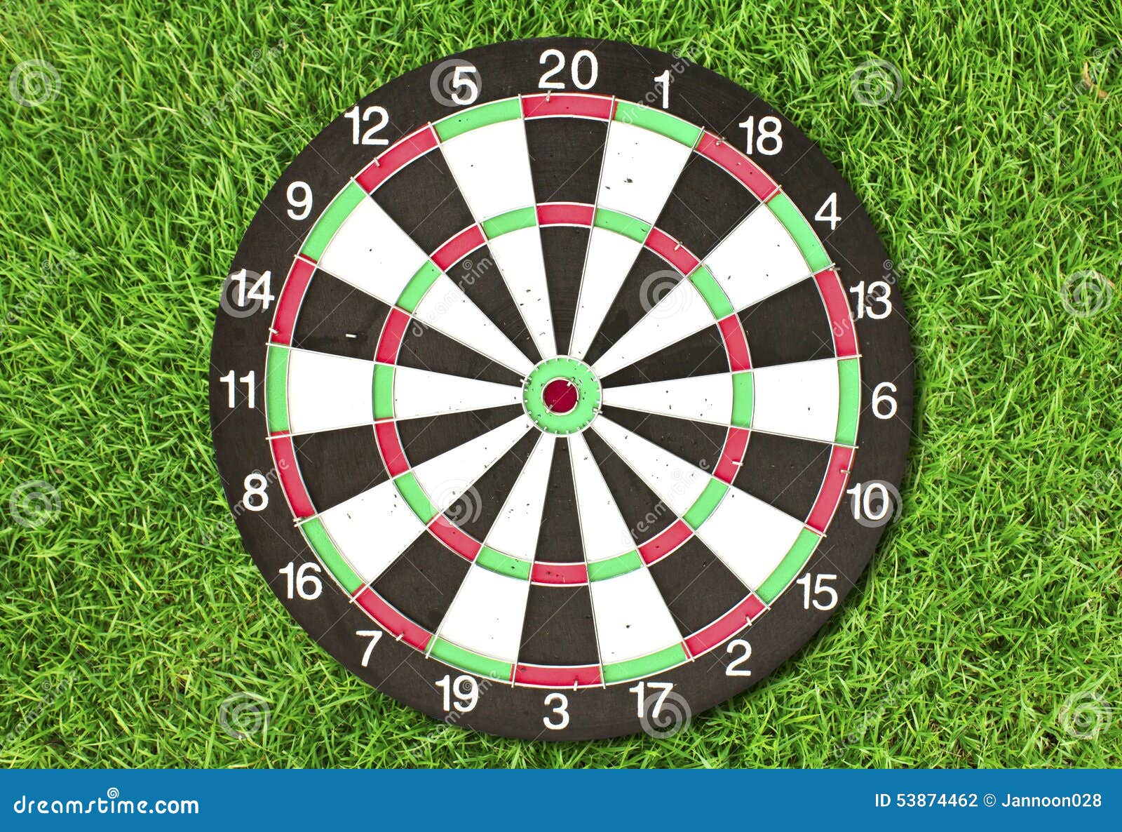 Dartboard on green grass stock photo. Image of achievement - 53874462