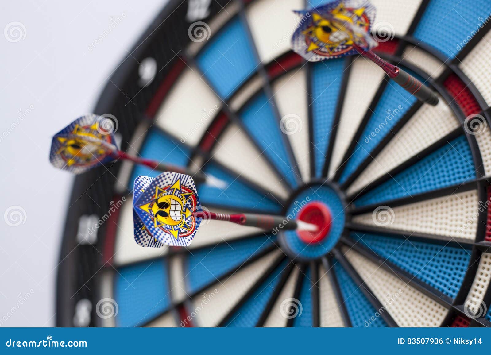 Dartboard with Three Darts, One Hit Bullseye with Some Selective Focus ... Dartboard with Three Darts, One Hit Bullseye with Some Selective Focus ...