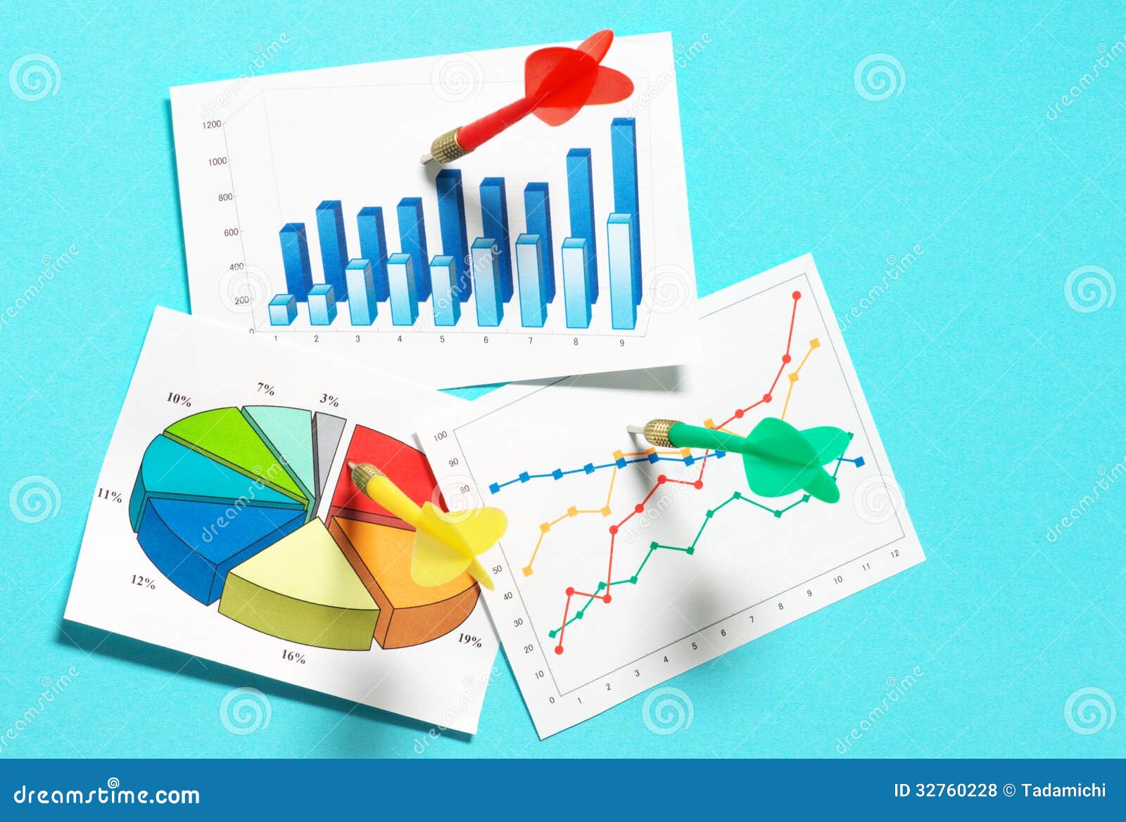 Darts sticking in graphs. stock photo. Image of data - 32760228