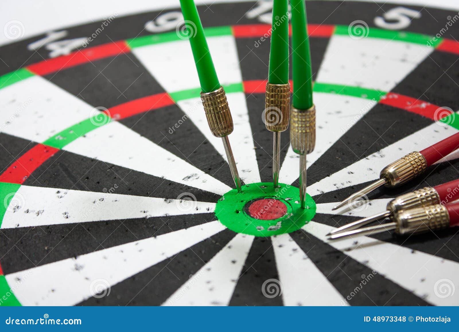 Darts stuck in a board stock photo. Image of leisure - 48973348 Darts stuck in a board stock photo. Image of leisure - 48973348