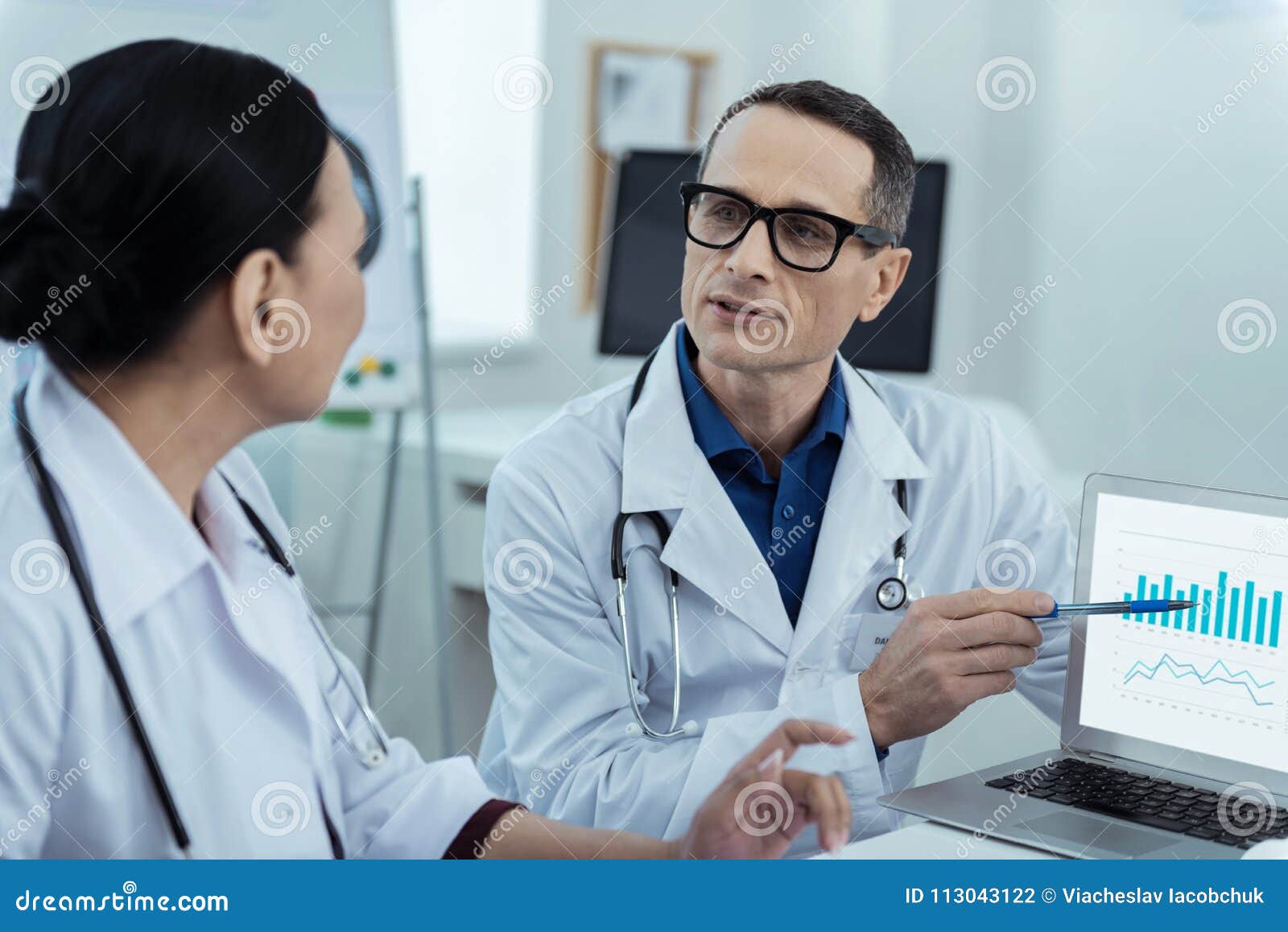 Knowledgeable Doctors Having a Discussion Stock Photo - Image of ...