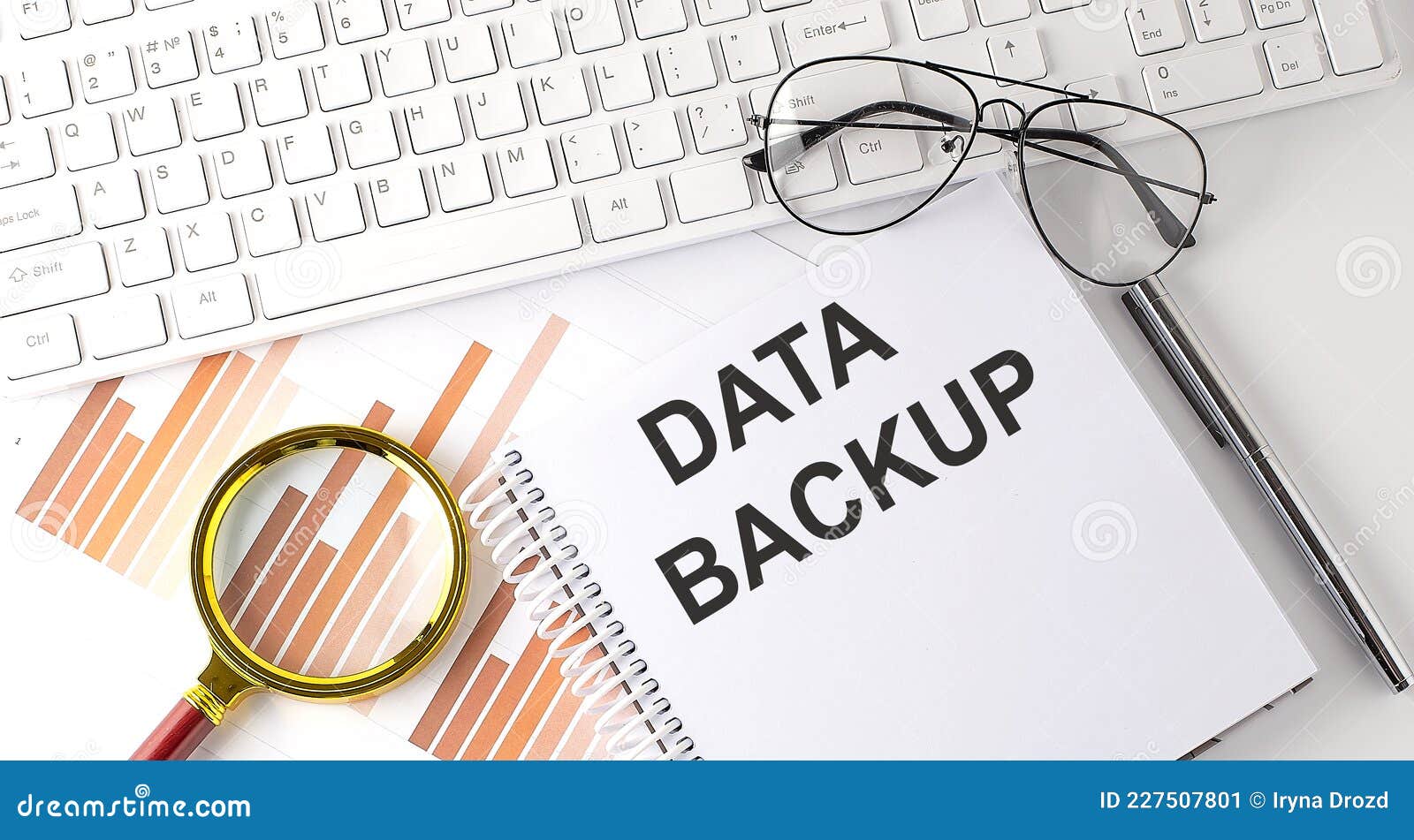DATA BACKUP Text Written on a Notebook with Keyboard, Chart,and Glasses ...