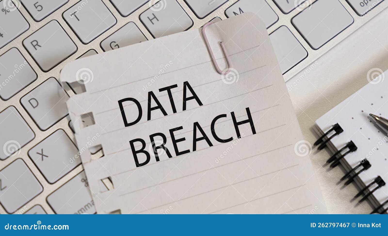 Data Breach Text on Paper Lying on the Keyboard with a Notepad and a ...