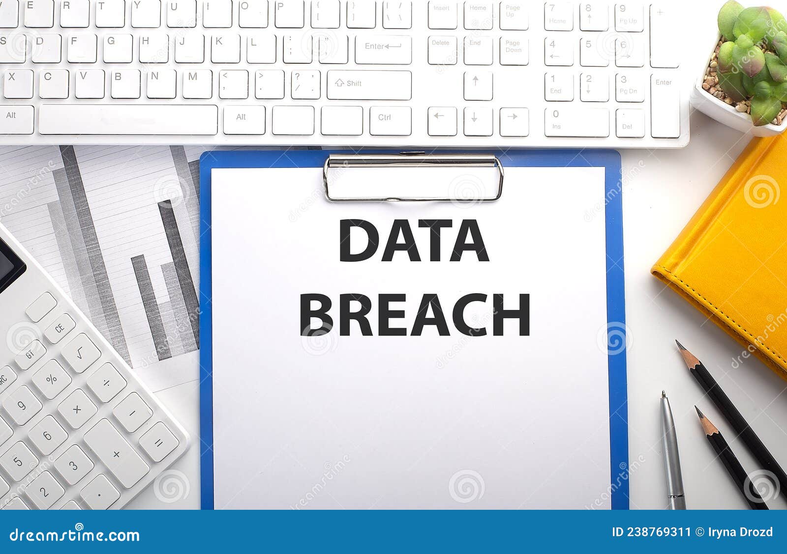 DATA BREACH Written on the Paper with Keyboard, Chart, Calculator and ...