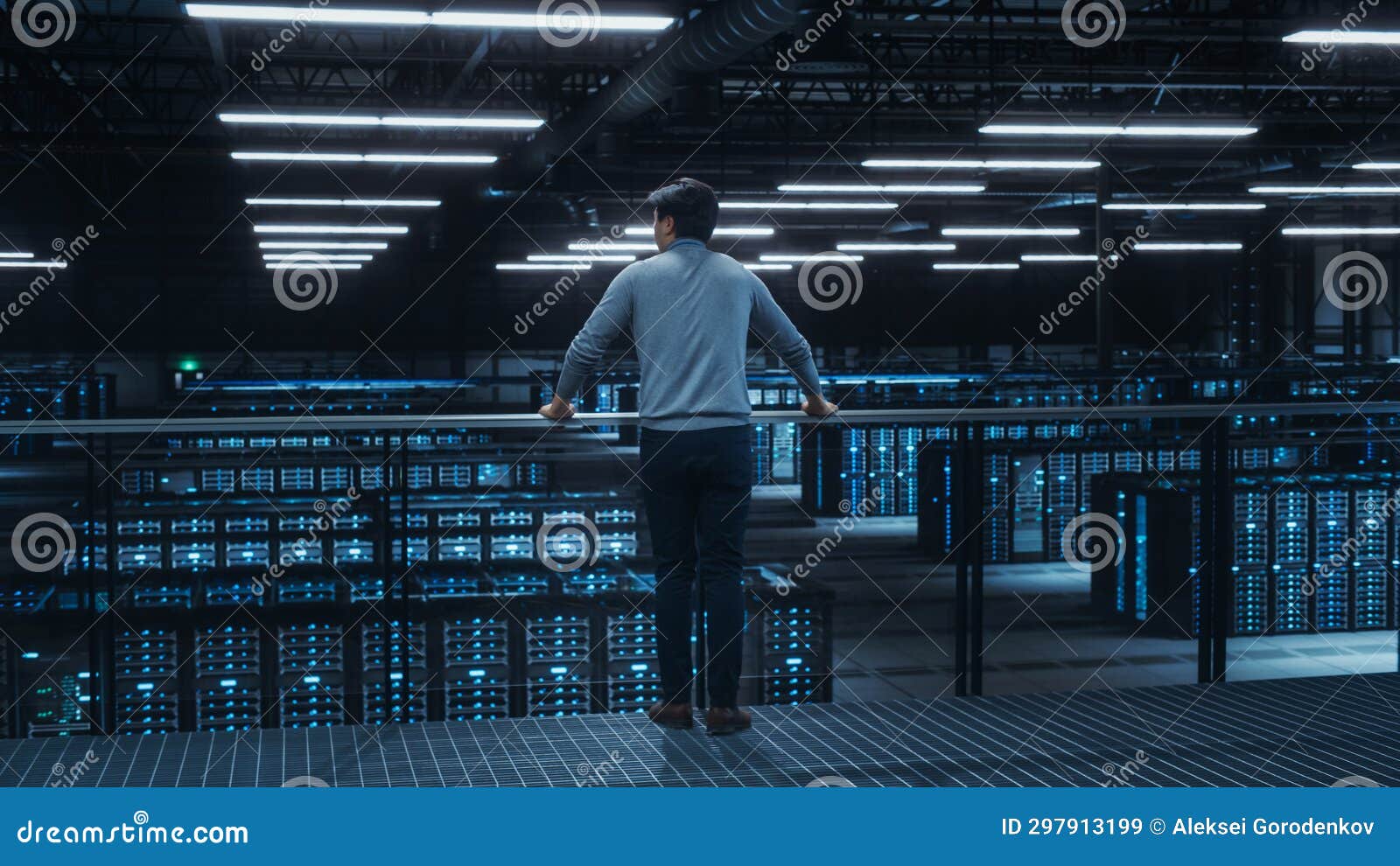 Data Center Engineer Looking Down from a Balcony on Server Farm Cloud ...