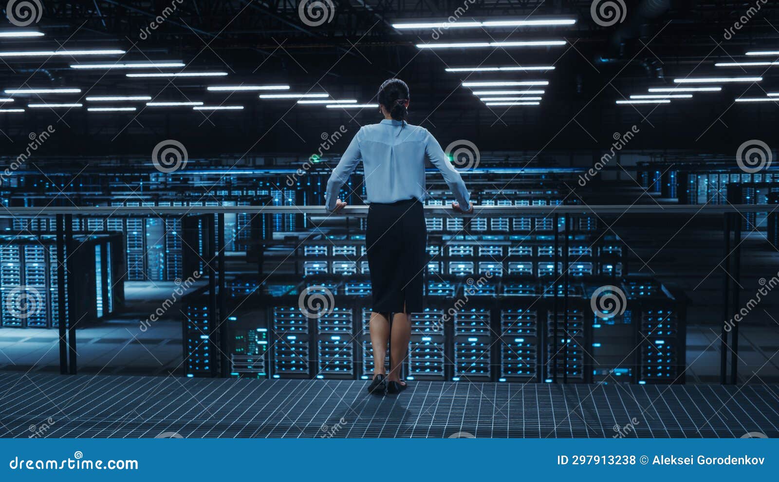 Data Center Engineer Looking Down from a Balcony on Server Farm Cloud ...