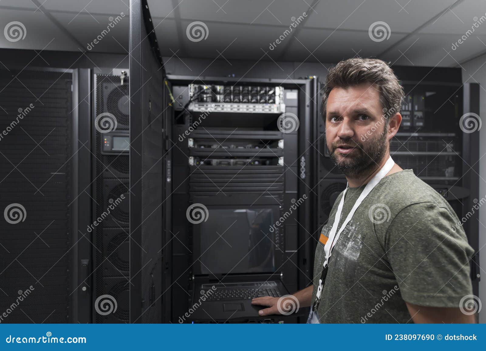 Data Center Engineer Usaing Keyboard on a Supercomputer Server Room ...