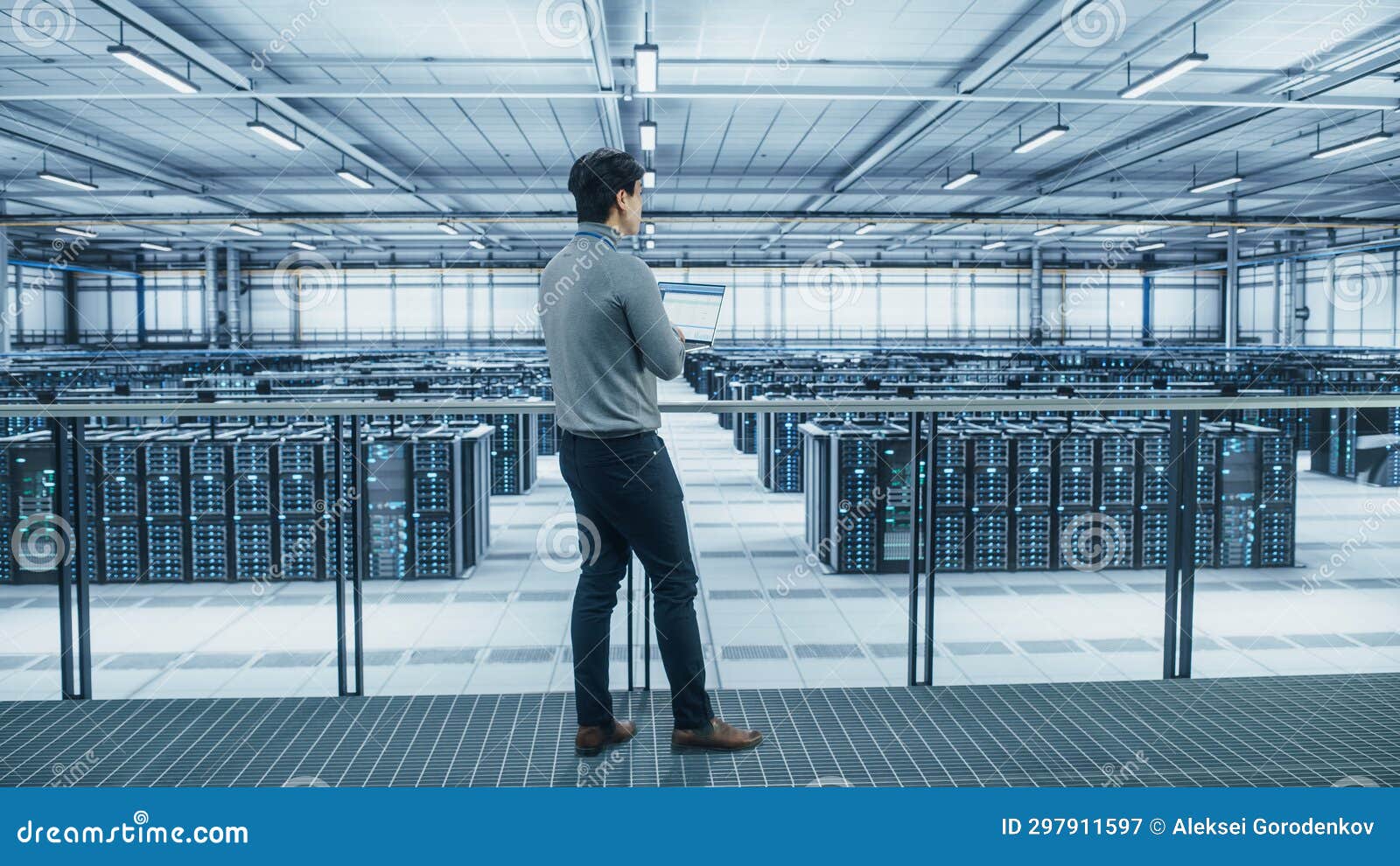 Data Center Engineer Using Laptop Computer. Server Farm Cloud Computing ...