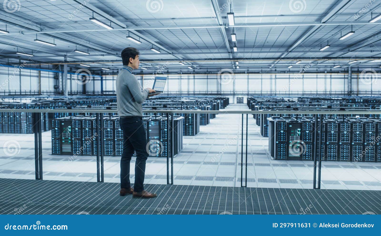 Data Center Engineer Using Laptop Computer. Server Farm Cloud Computing ...