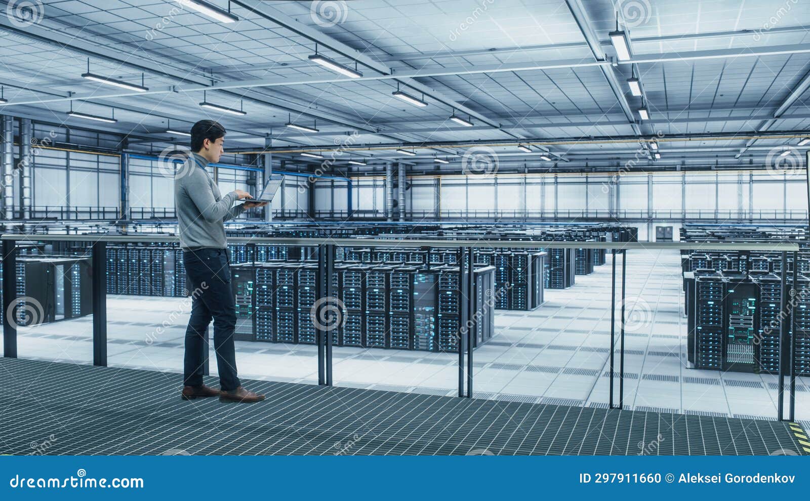 Data Center Engineer Using Laptop Computer. Server Farm Cloud Computing ...
