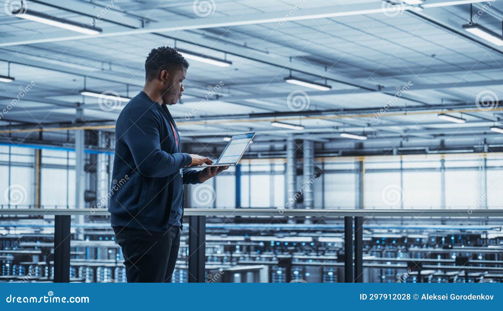 Data Center Engineer Using Laptop Computer. Server Farm Cloud Computing ...