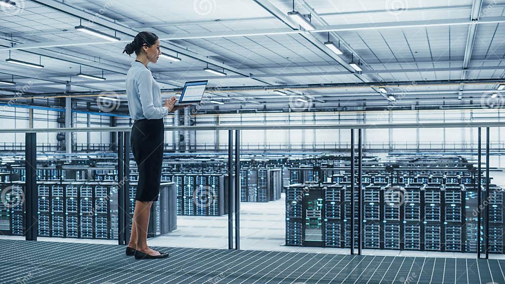 Data Center Engineer Using Laptop Computer. Server Farm Cloud Computing ...