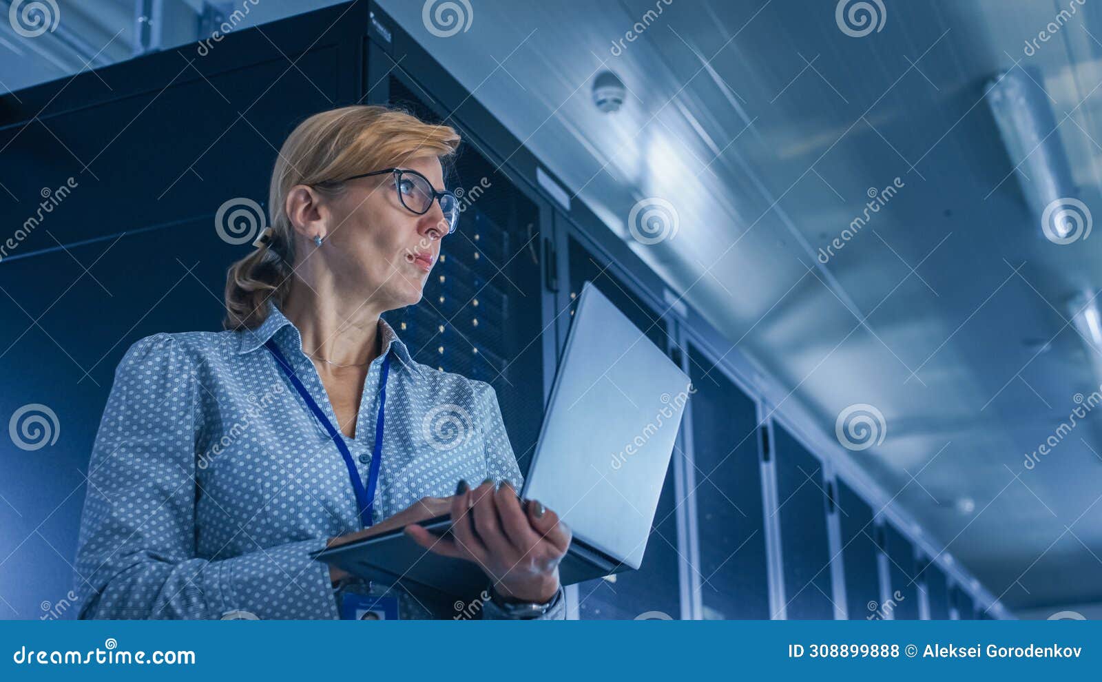 In Data Center: Female it Technician Running Maintenance Programme on a ...