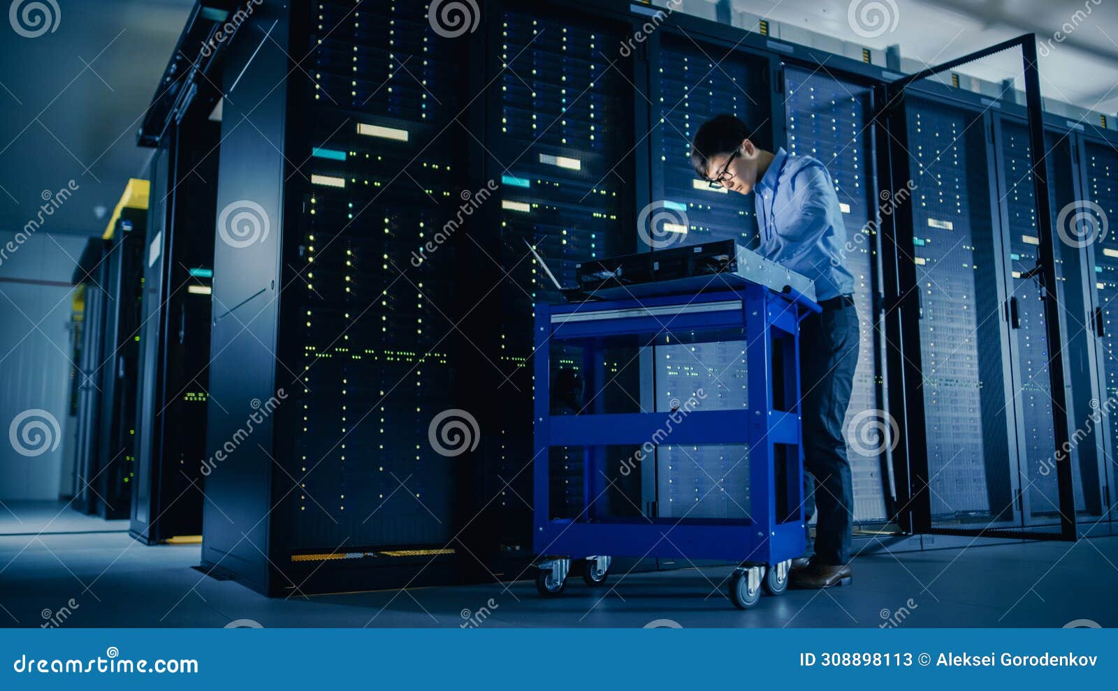 In Data Center: Male it Technician Running Maintenance Programme on a ...