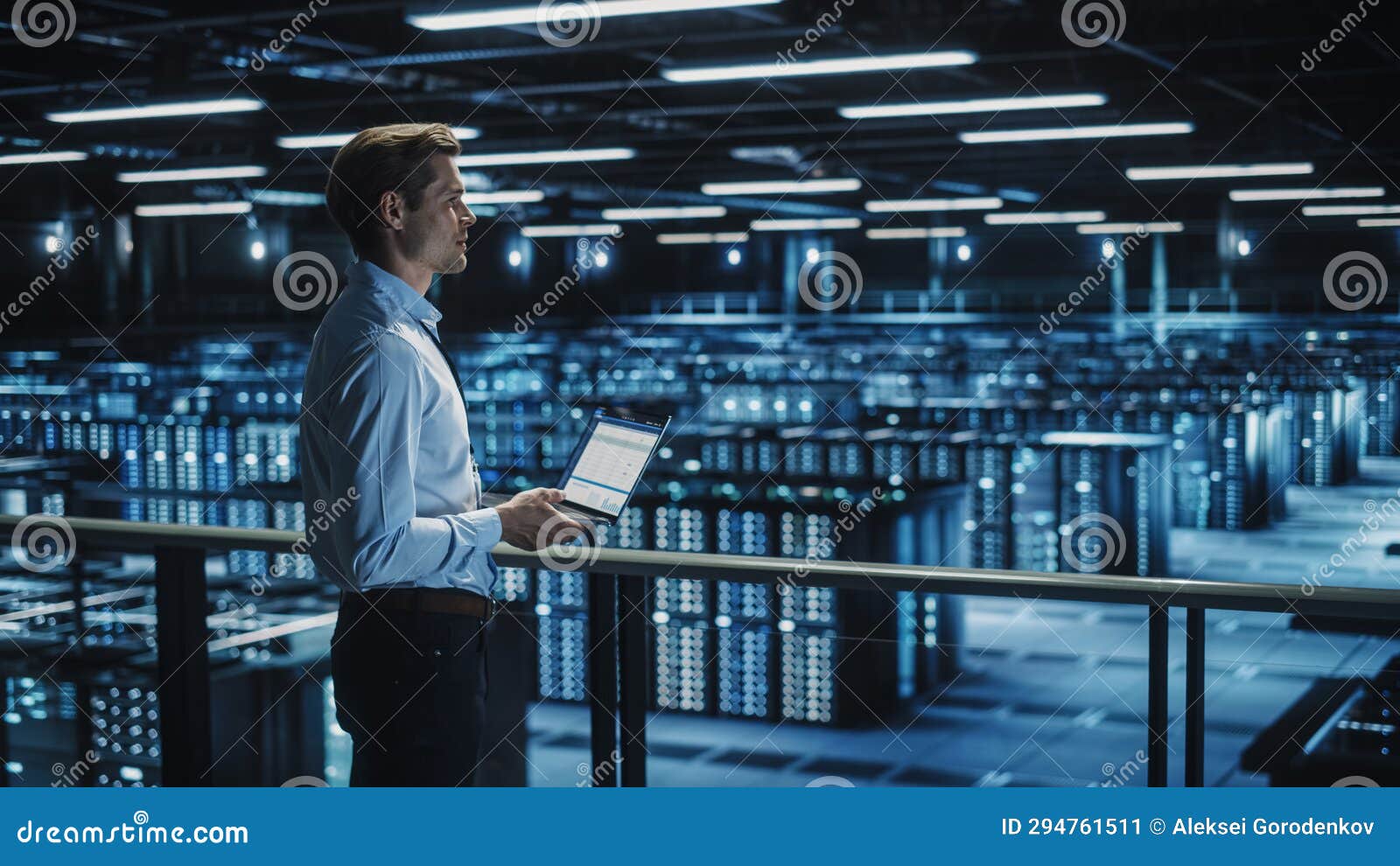 Data Center Specialist Engineer Using Laptop Computer. Server Farm ...