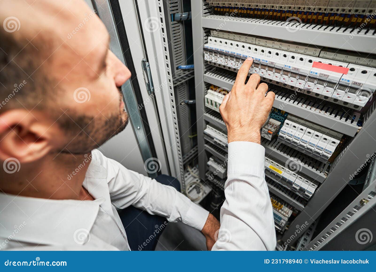 Data Facility Worker Switching Off Power Supply To One Equipment Stock ...