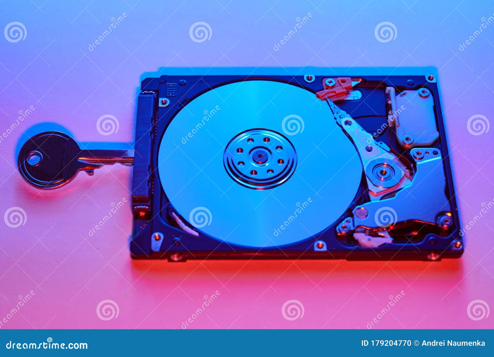 Data Security Concept. Key on Spindle of a Hard Disk Drive. Opened Hard ...