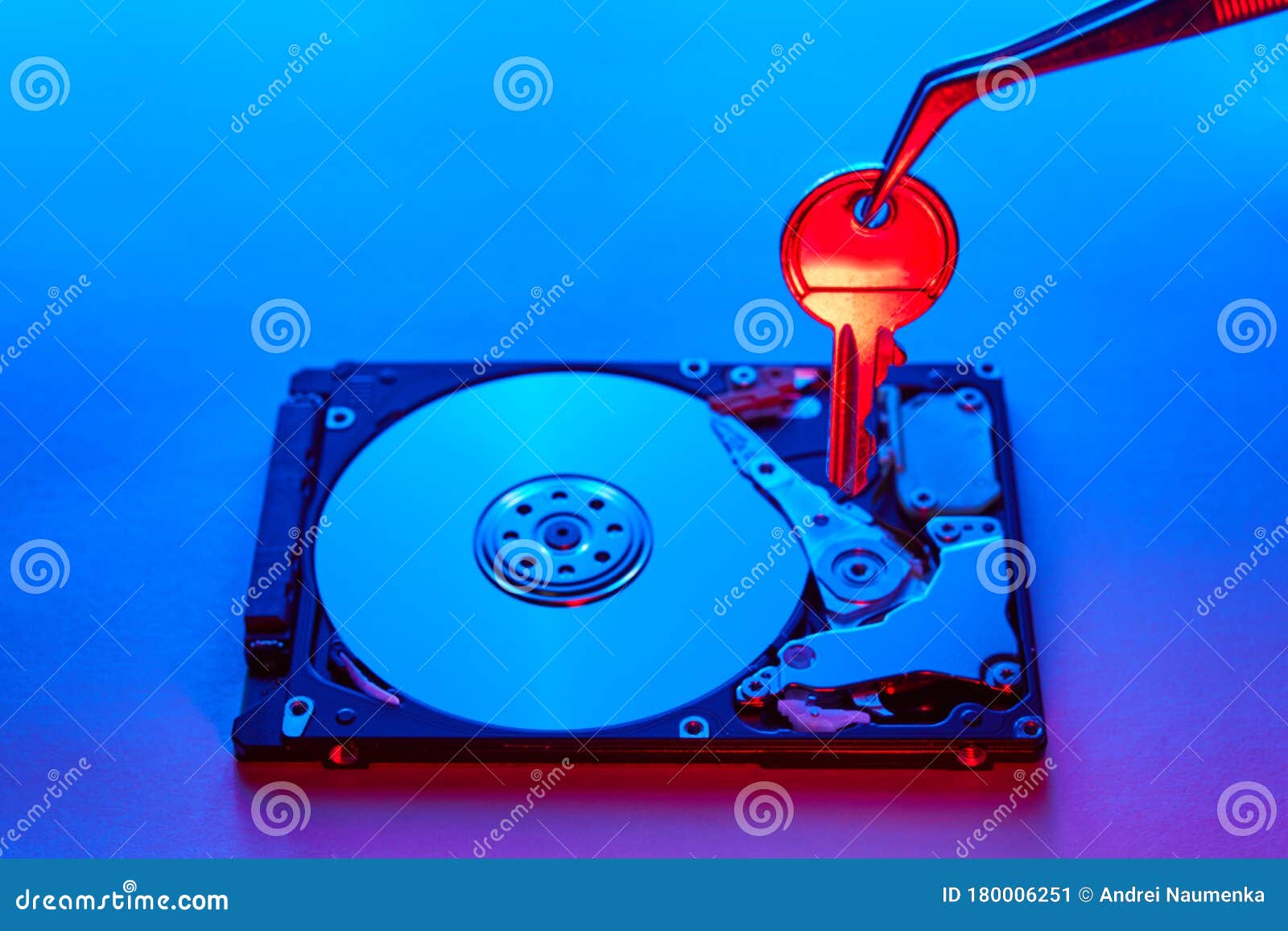 Data Security Concept. Key on Spindle of a Hard Disk Drive. Opened Hard ...