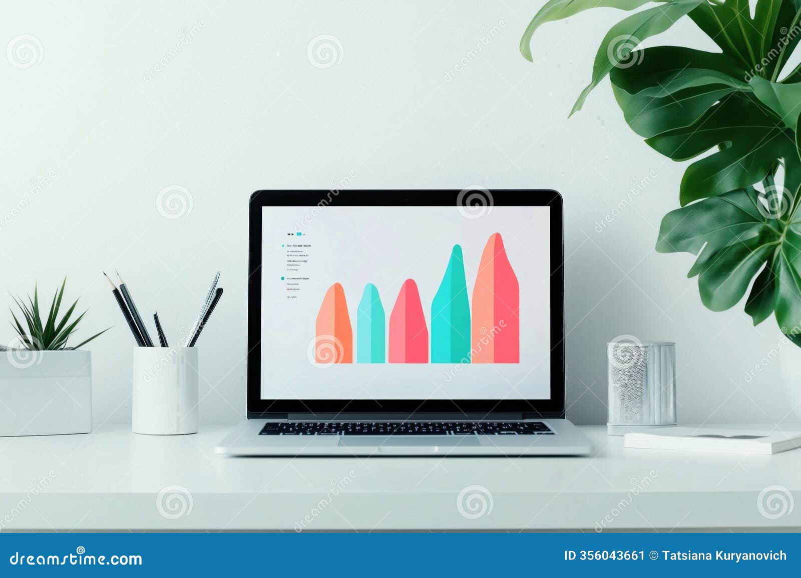 Data Visualization on Laptop Screen, Modern Workspace, Green Plant ...