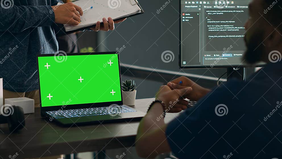 Database Admins Analyzing Source Code And Greenscreen Display On 4204