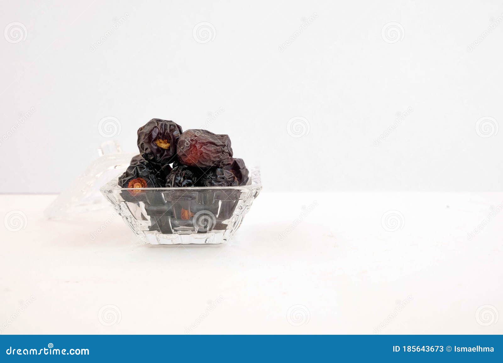 Dates in Glass Container Over White. High in Natural Sugar Packed with ...